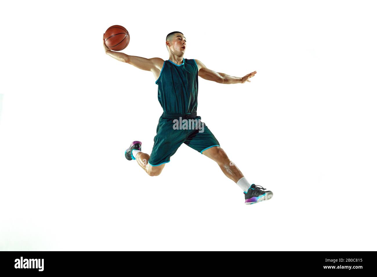 Young basketball player of team wearing sportwear training, practicing ...