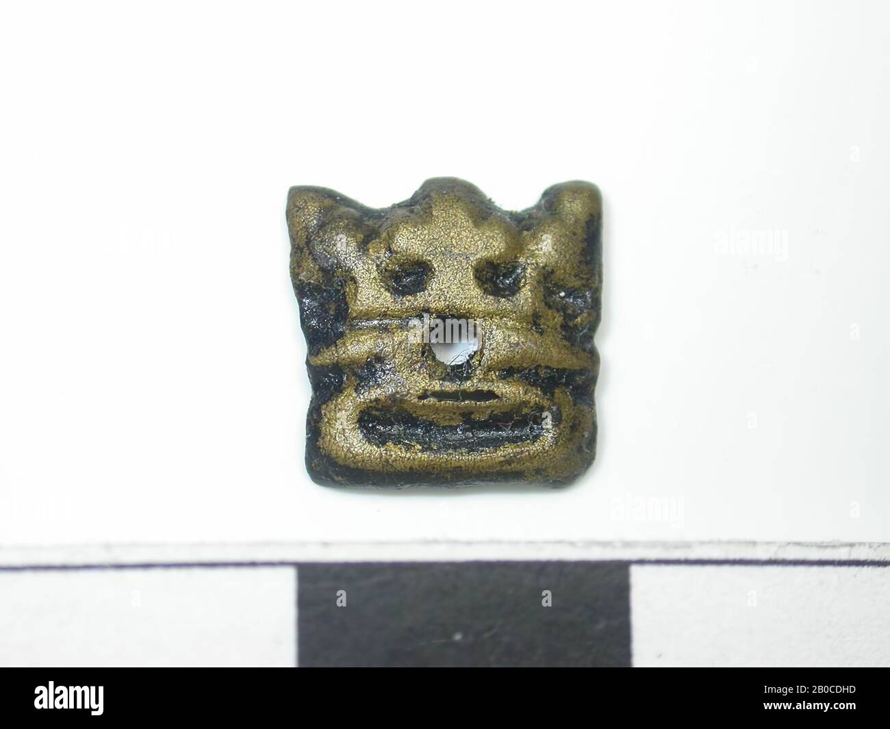 Crown, gold (copper alloy). Three point crown with fleur-de-lis. Hole ...