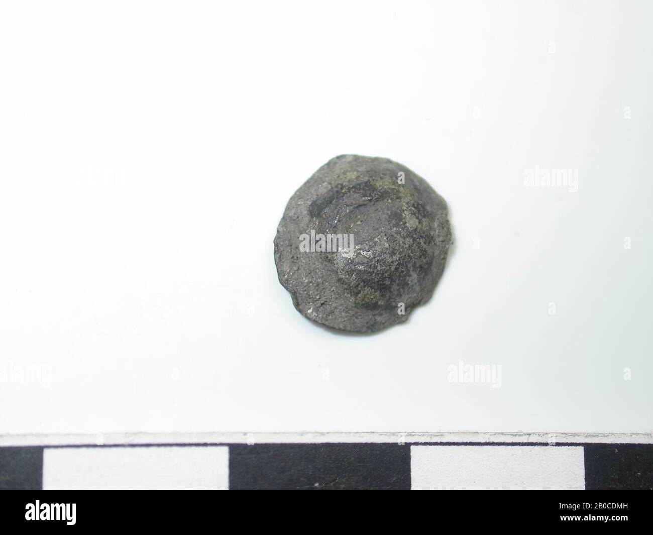 Cap of a rivet, black (lead Stock Photo - Alamy