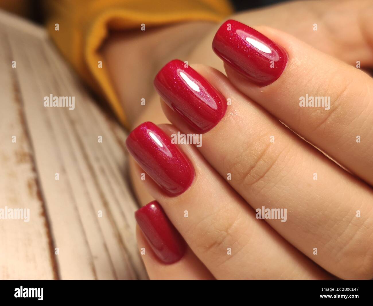 beautiful gel lacquer manicure on a textured trendy background Stock ...
