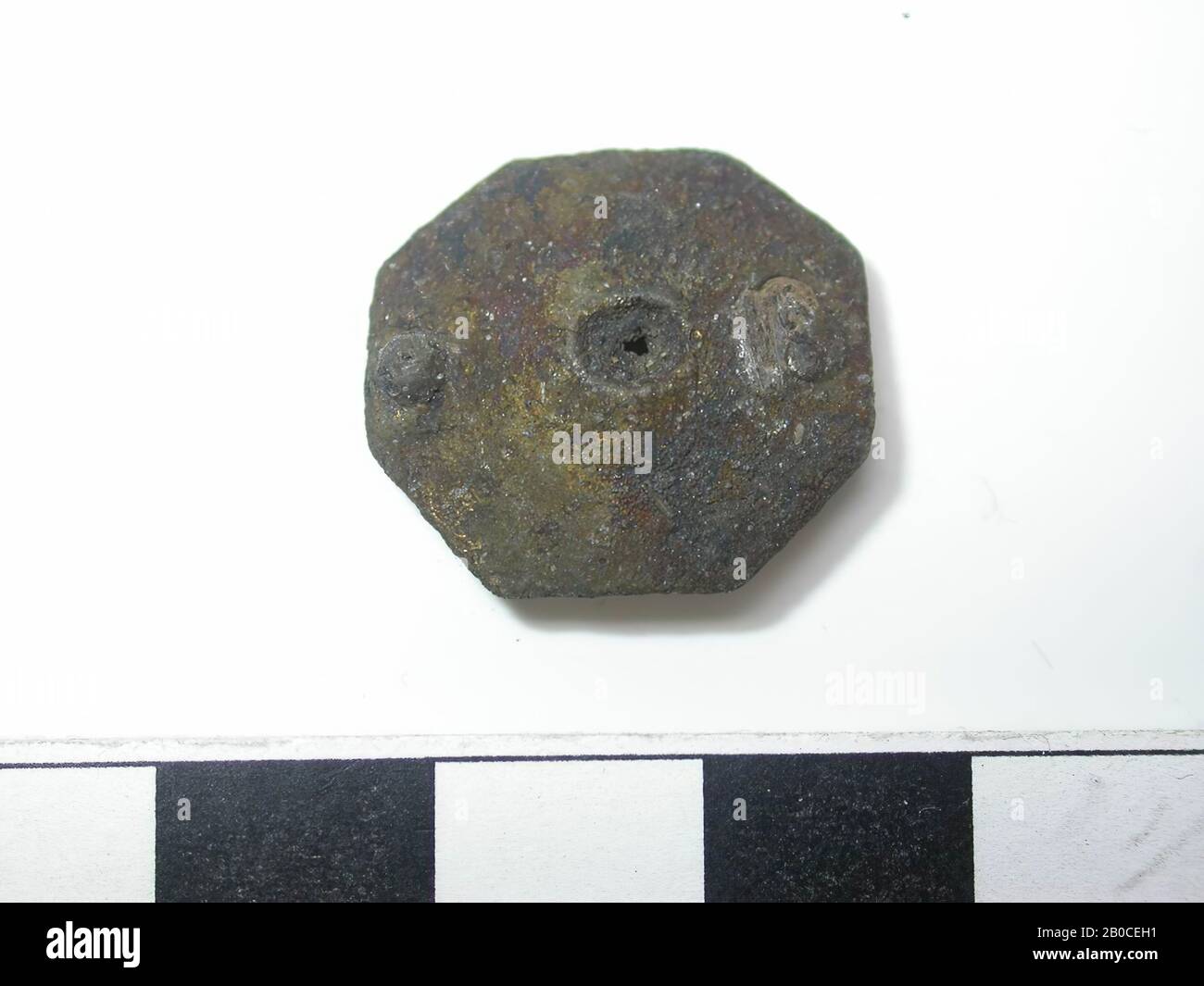 Octagon shape, gold (copper alloy). Octagon shape with a hole in the ...