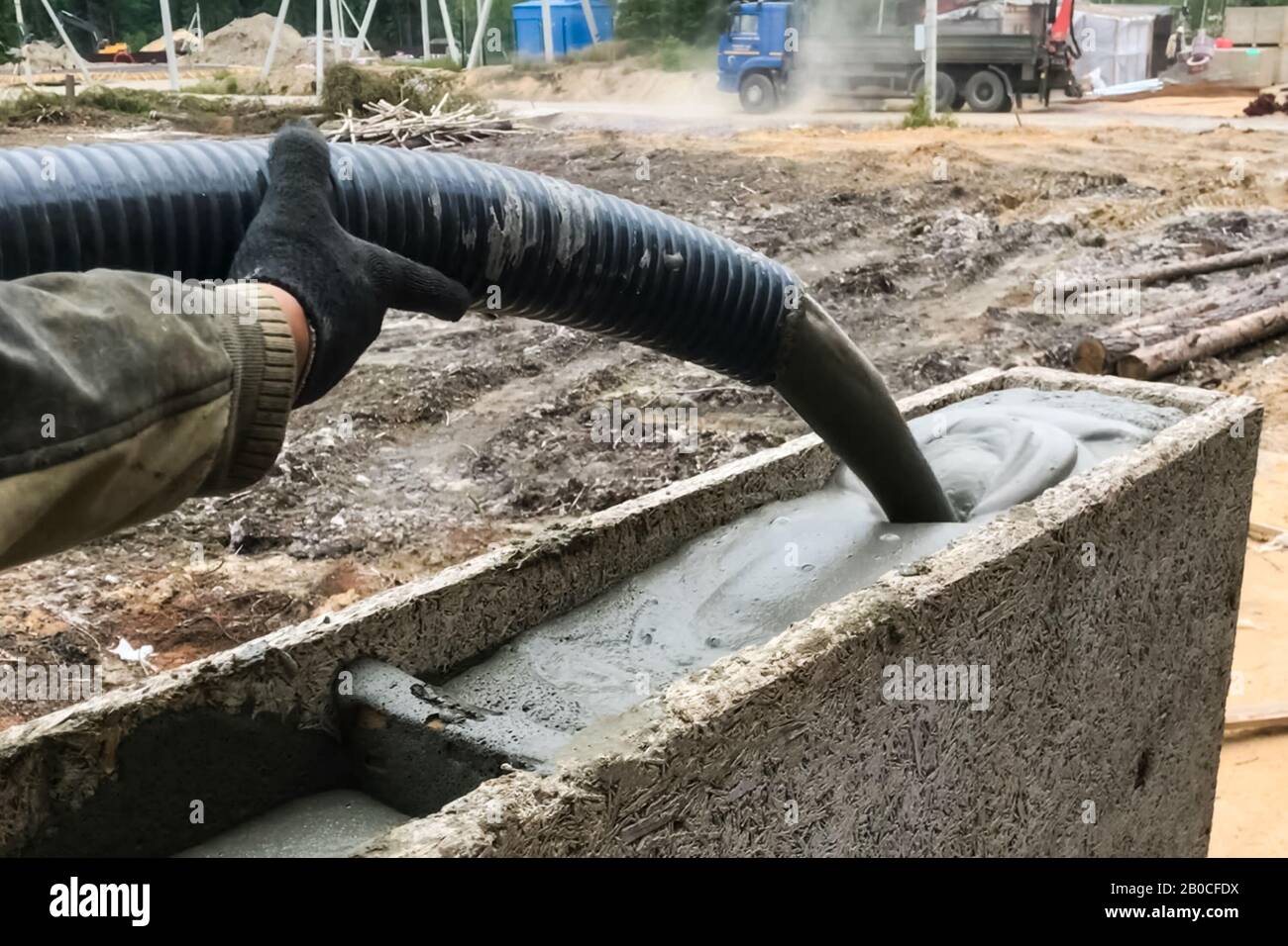 Pouring foam into the formwork to create walls Stock Photo - Alamy