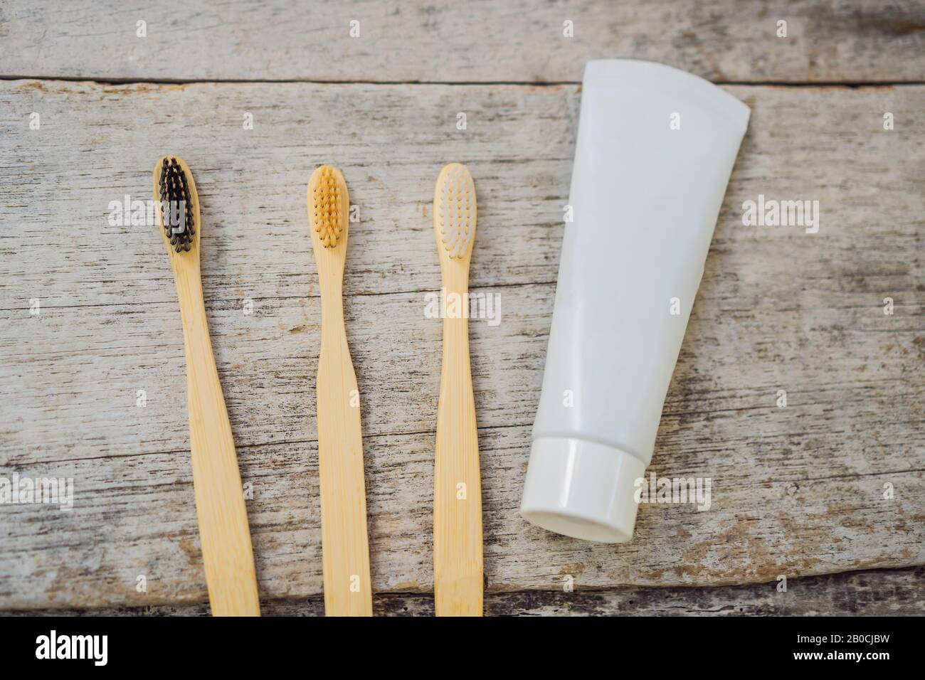 Zero waste concept. Bamboo toothbrush on wooden background. Plastic ...