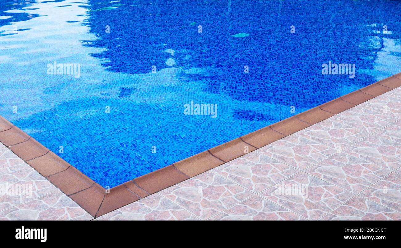 Outdoor swimming pool at summer time Stock Photo - Alamy