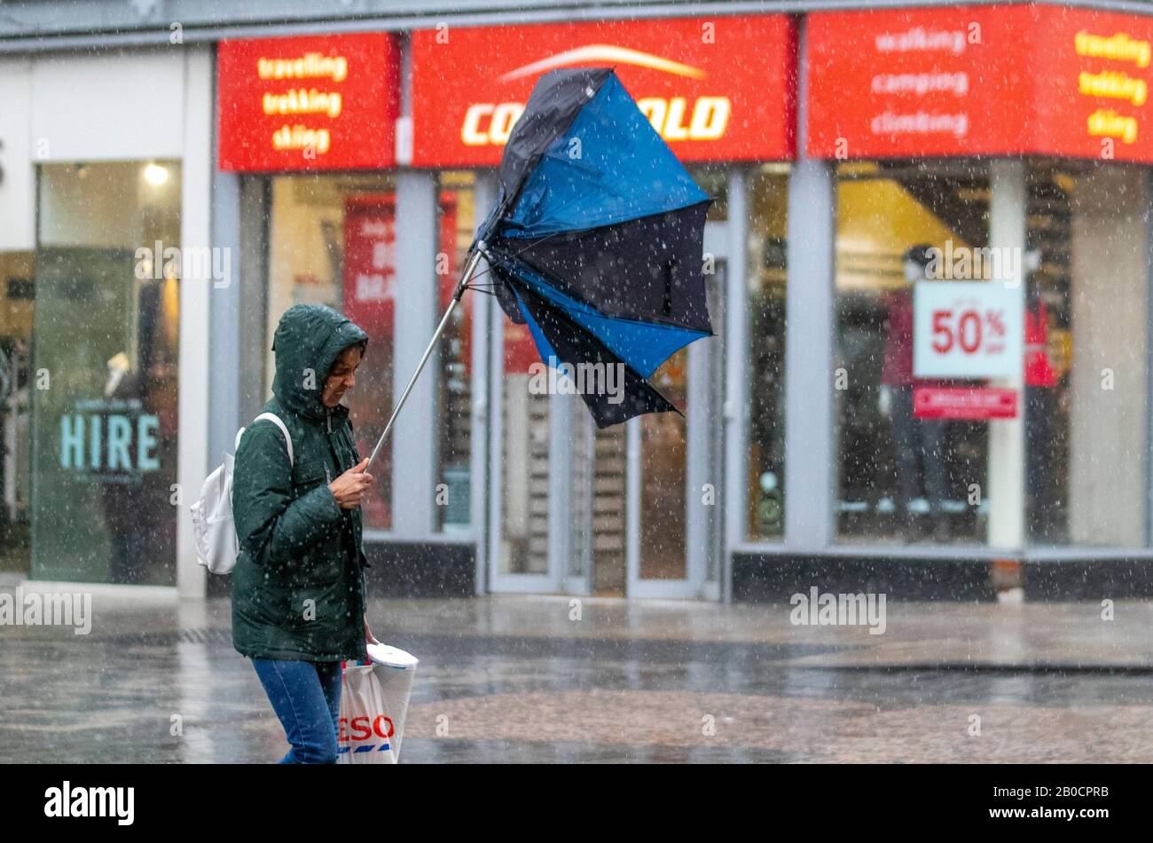 Strong winds blowing umbrella inside out in Preston, Lancashire. Feb ...