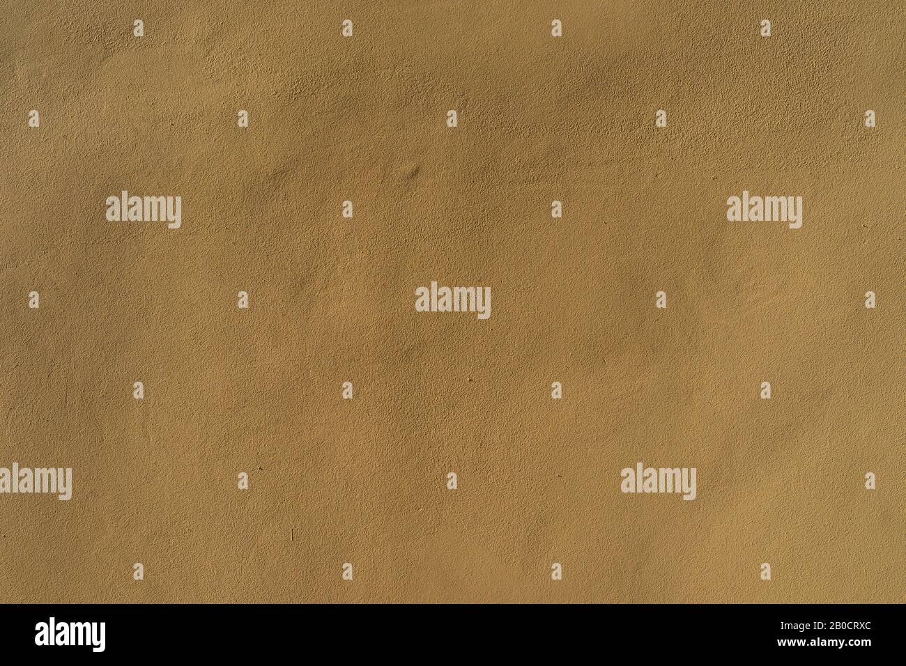 Painted yellow wall of a building Stock Photo - Alamy