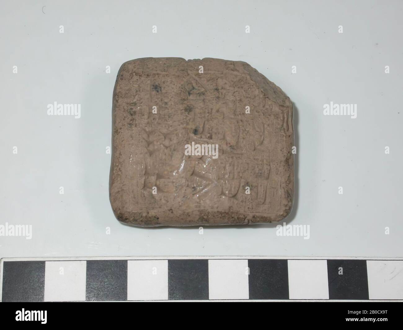 The clay tablet is more or less square. The corners are rounded. In ...