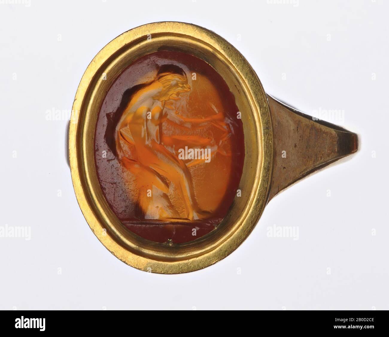 F: man, sitting to the right on tree stump, left leg bent, right leg ...