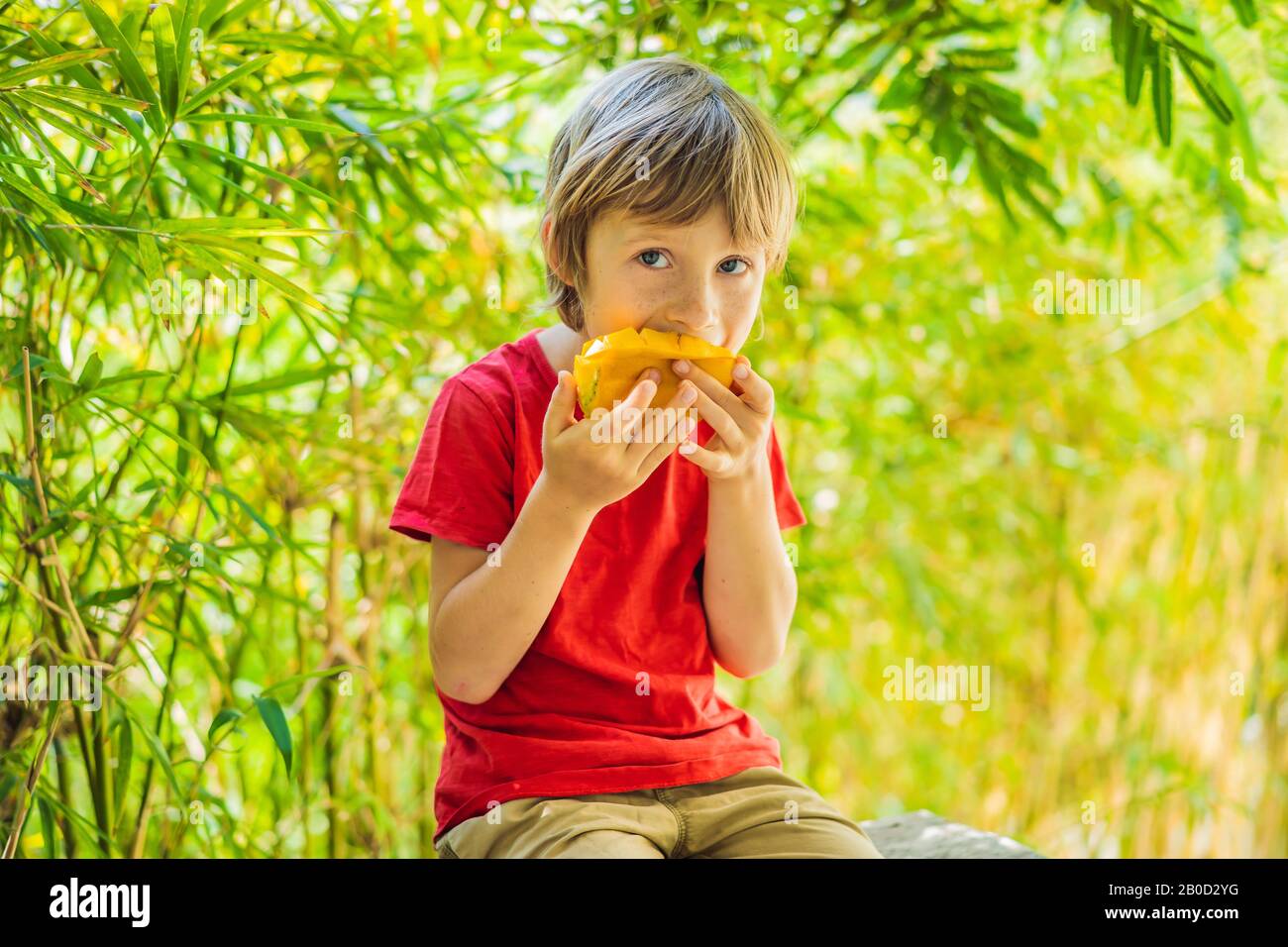 Child Eating Mango High Resolution Stock Photography and Images - Alamy
