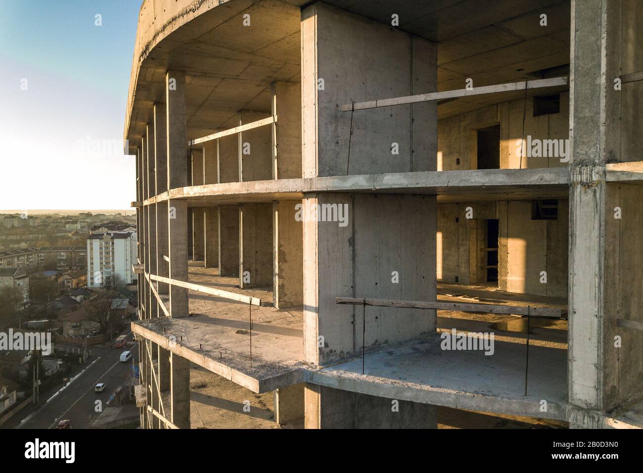 Aerial view of concrete frame of tall apartment building under ...