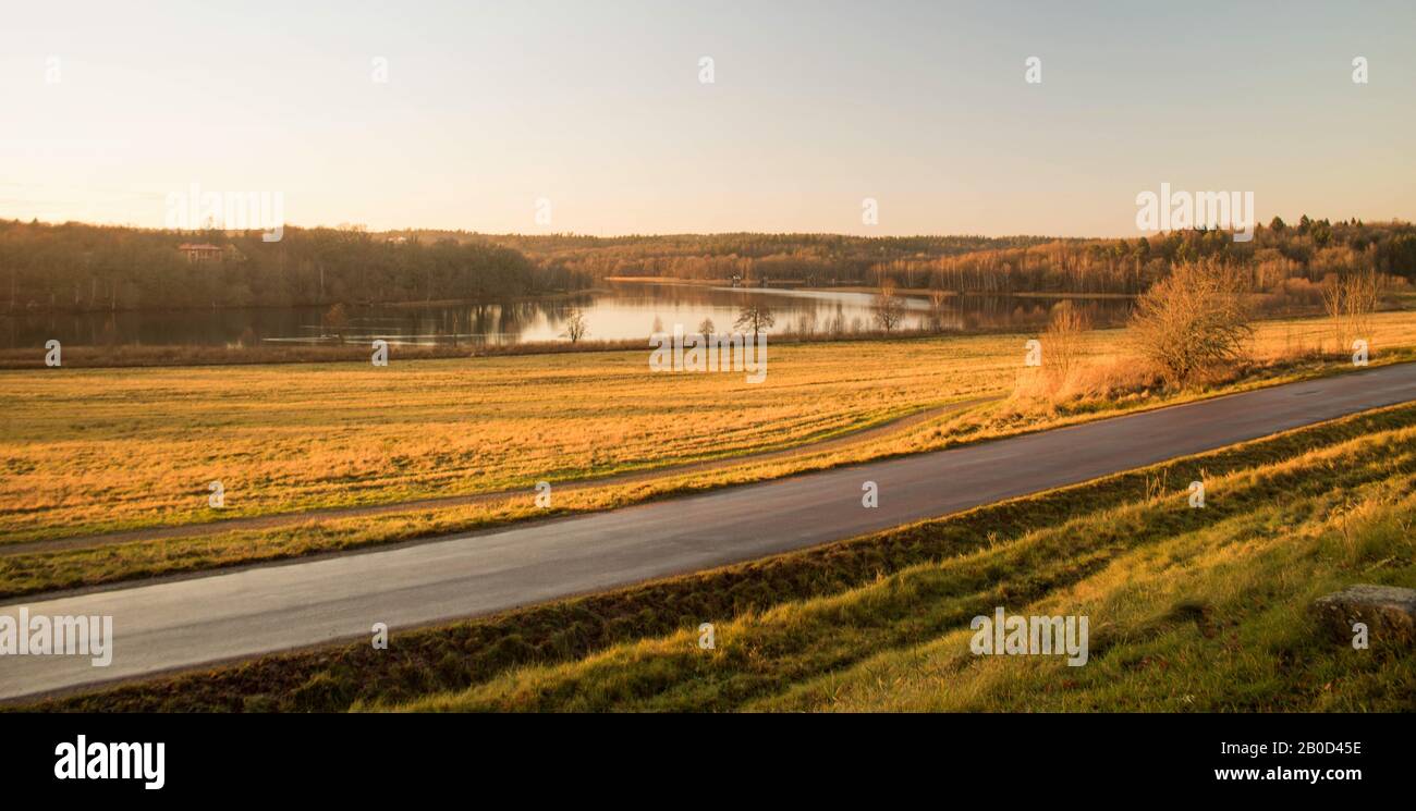 Landscape photo with a road passing through Stock Photo - Alamy