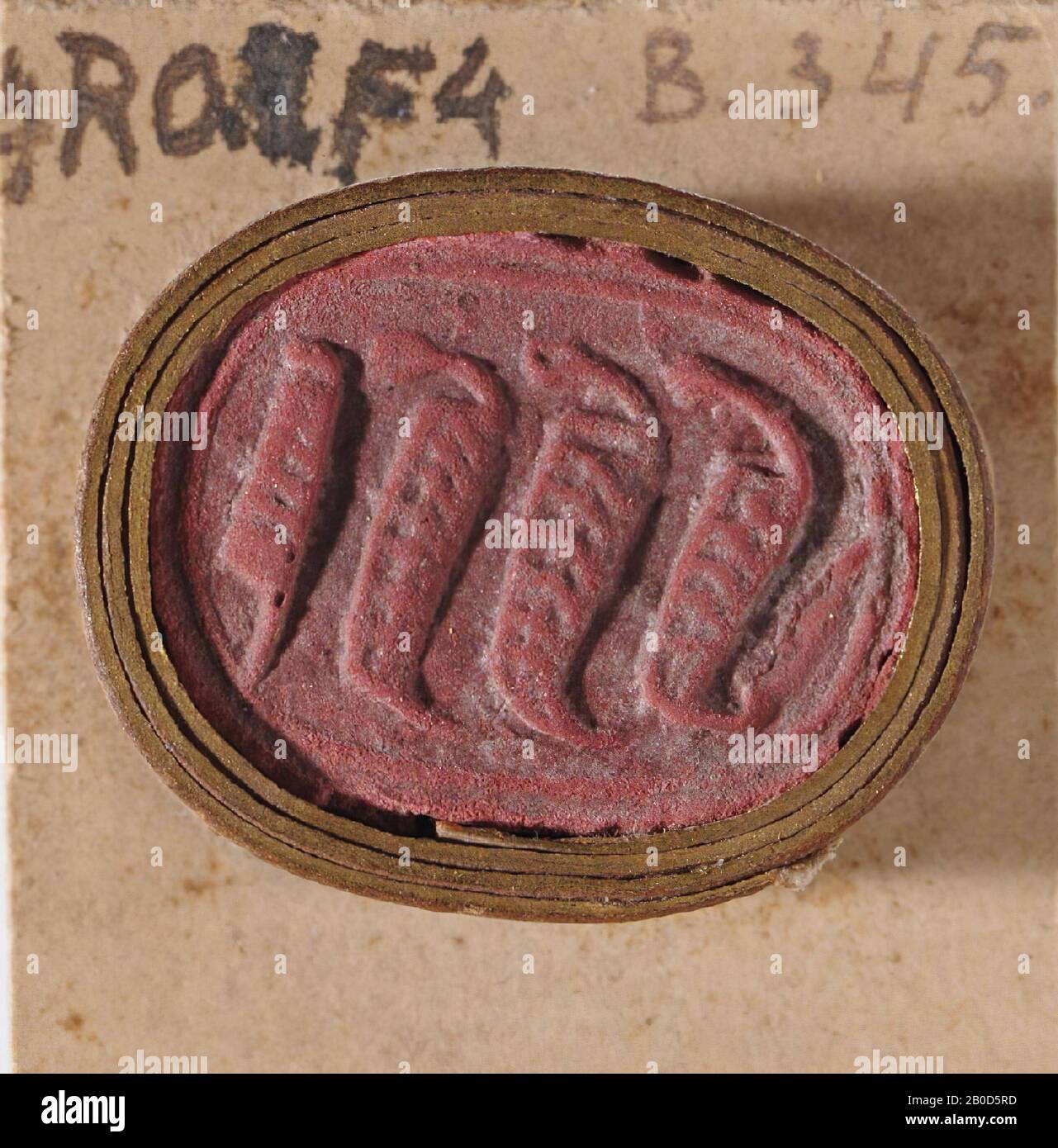 oval, human head, uraeus, feather, The scaraboid is made of a beige ...