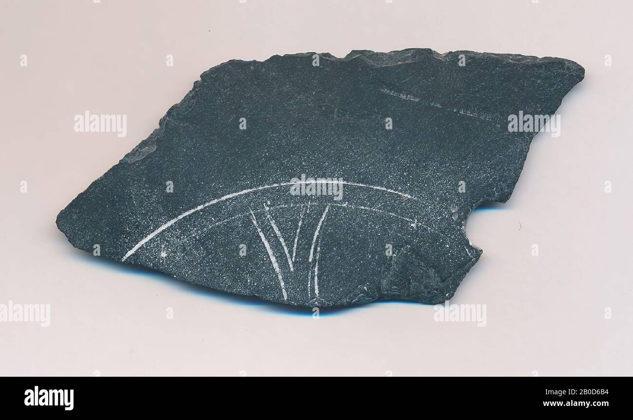 Piece of slate with a fragment of the drawing of a wheel on both sides ...