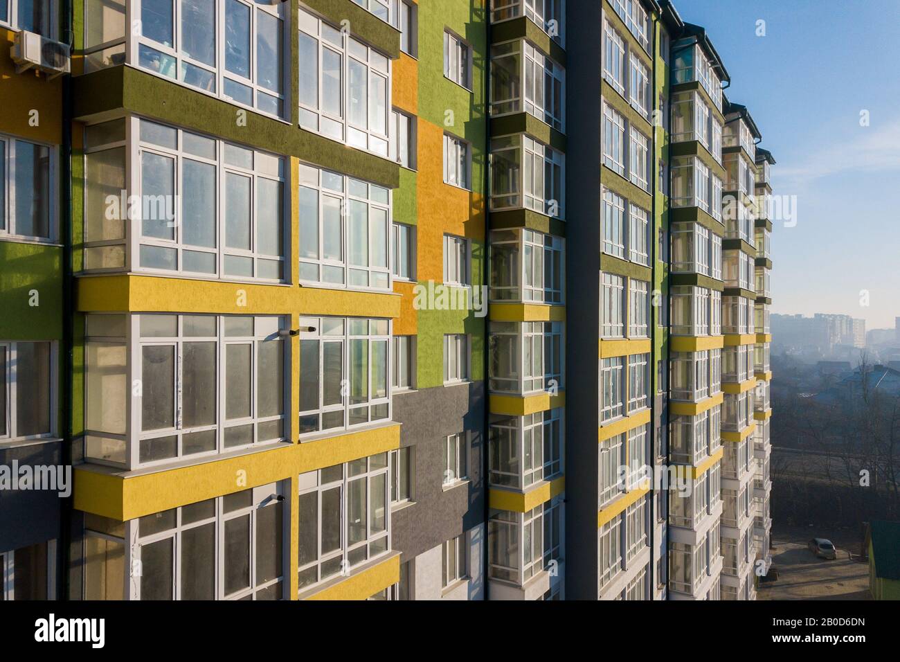 Aerial view of a tall residential apartment building with many windows ... Aerial view of a tall residential apartment building with many windows ...