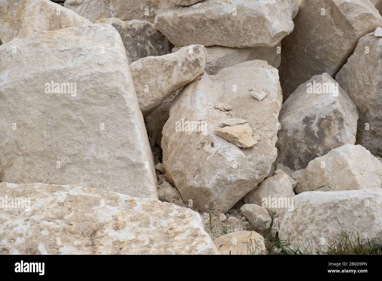 Big pile of large sand stones laying on the ground of construction site ...