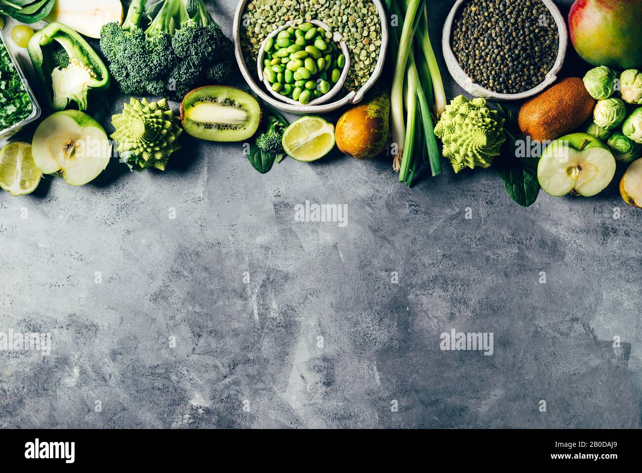 Variety of Green Vegetables and Fruits on the grey background Stock ...