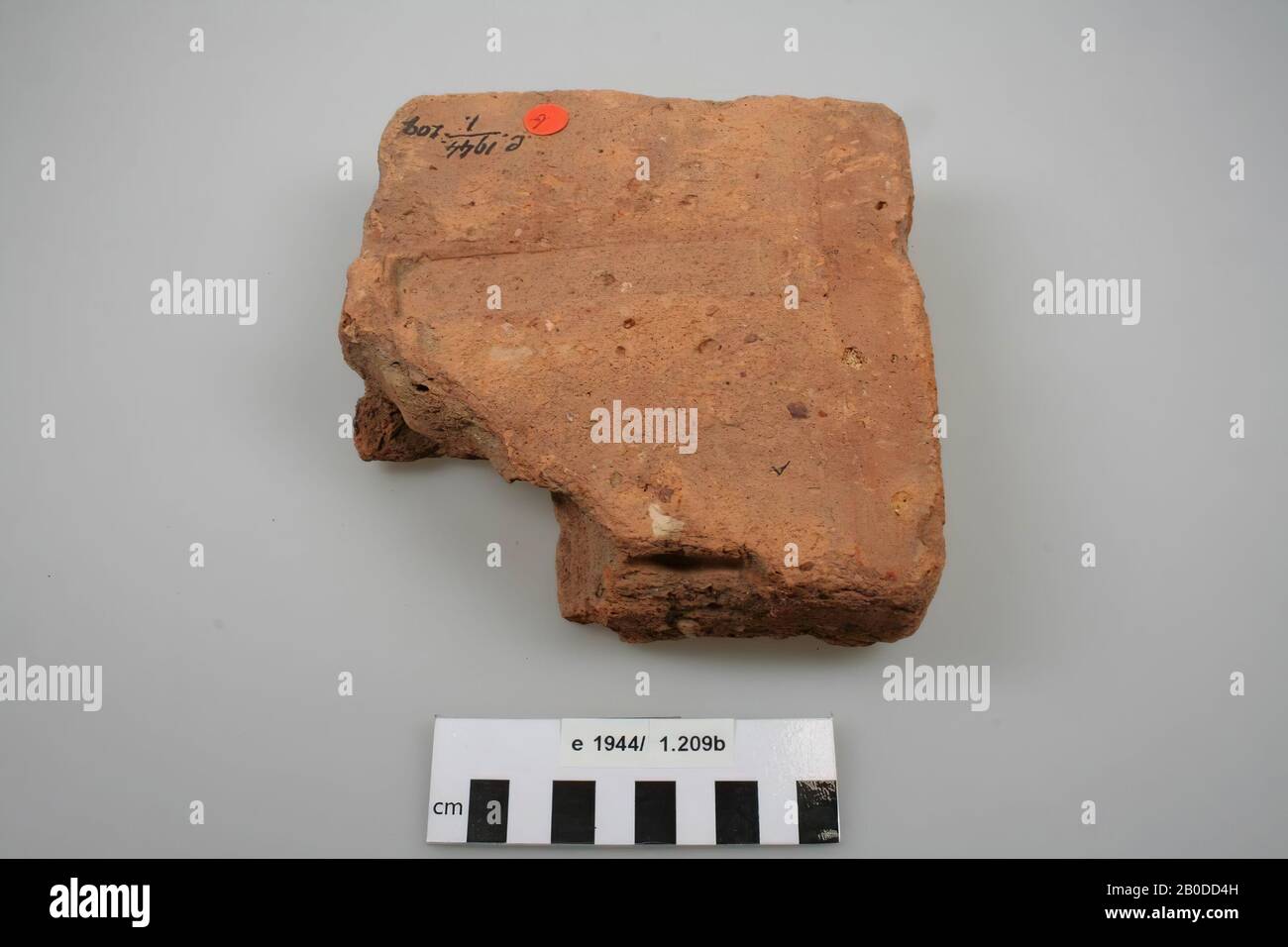 Later of brick with stamp. A corner of the later is missing., Later ...