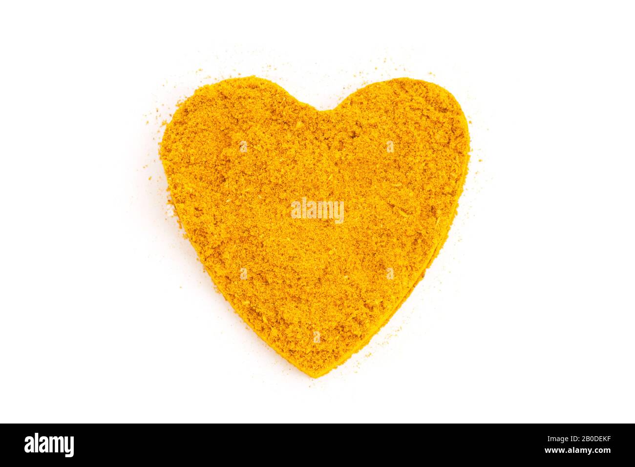 Heap ground Curry (Madras Curry) isolated in heart shape on white ...