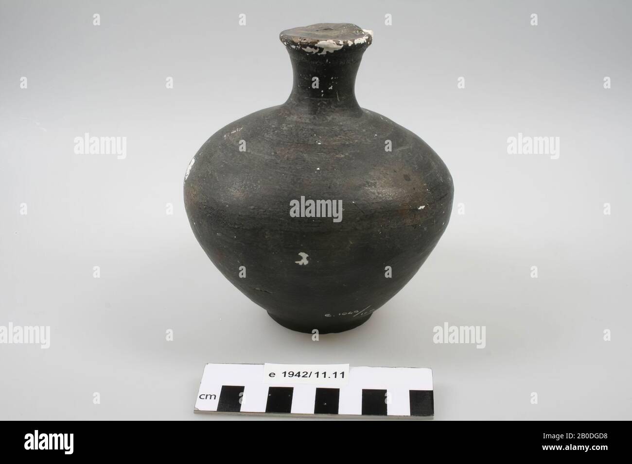 Plaster cast of a bottle-shaped object with 1 opening in the neck and 5 ...