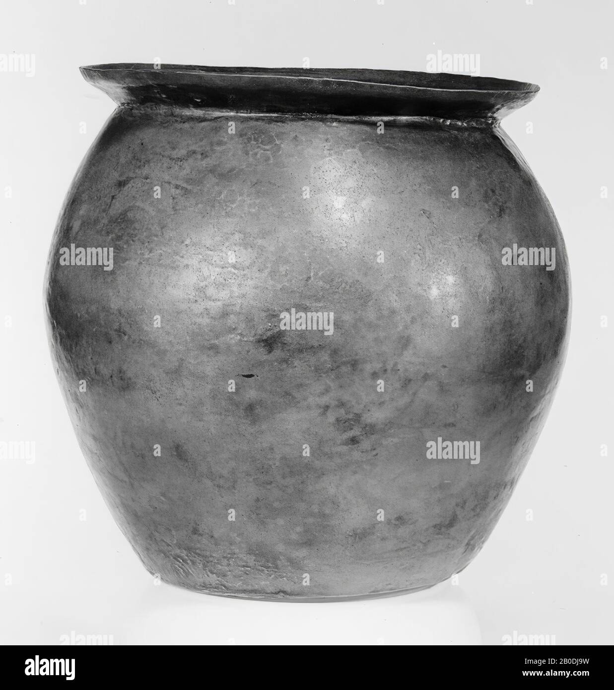 Bronze cooking pot. In the edge on both sides holes for missing handle ...