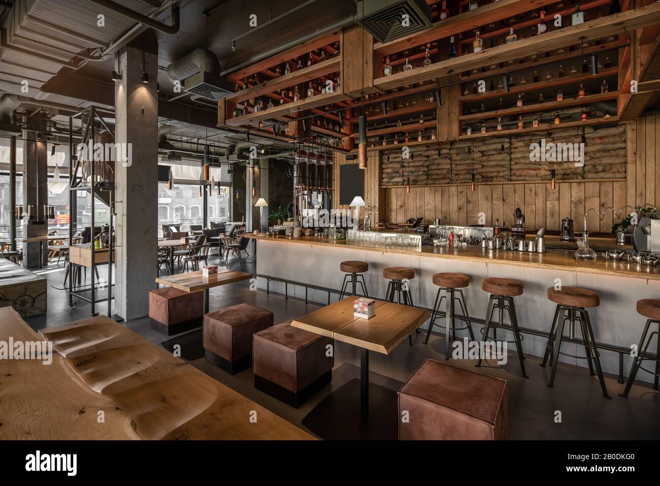 Stylish coffee house in a loft style with big panoramic windows and ...