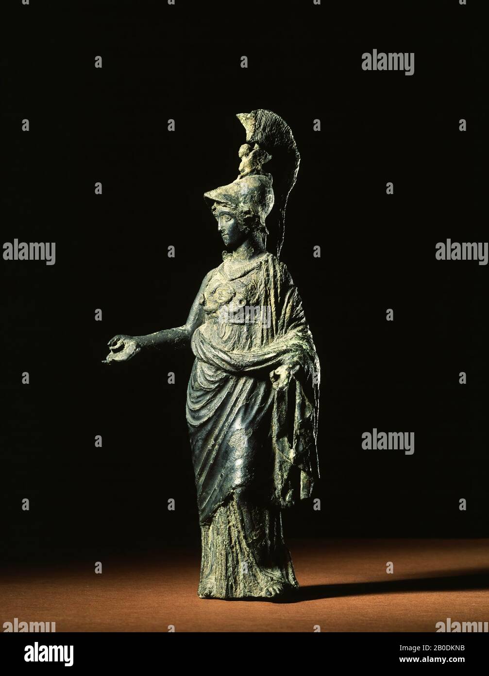 Bronze. Figurine of Minerva with helmet. Helmboshouder in the form of a ...