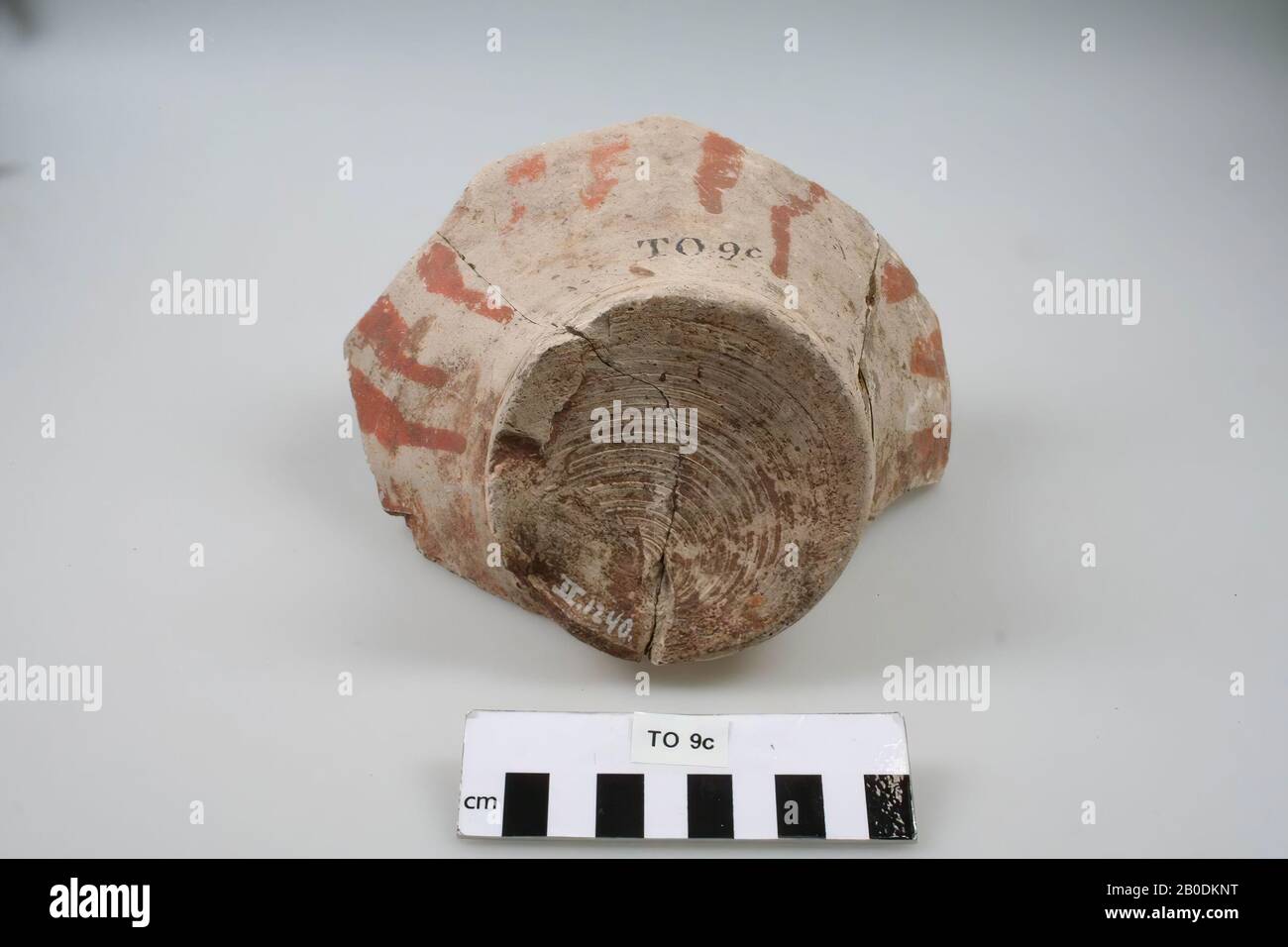 Fragment of the foot and belly of a jug, three old bonds over foot and ...