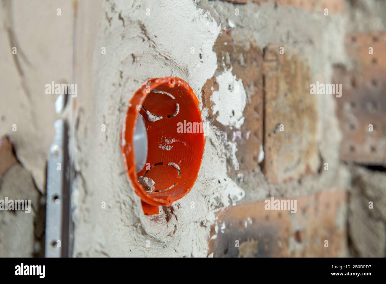 Socket orange boxes with wires in a wall. Cabling installation of ...