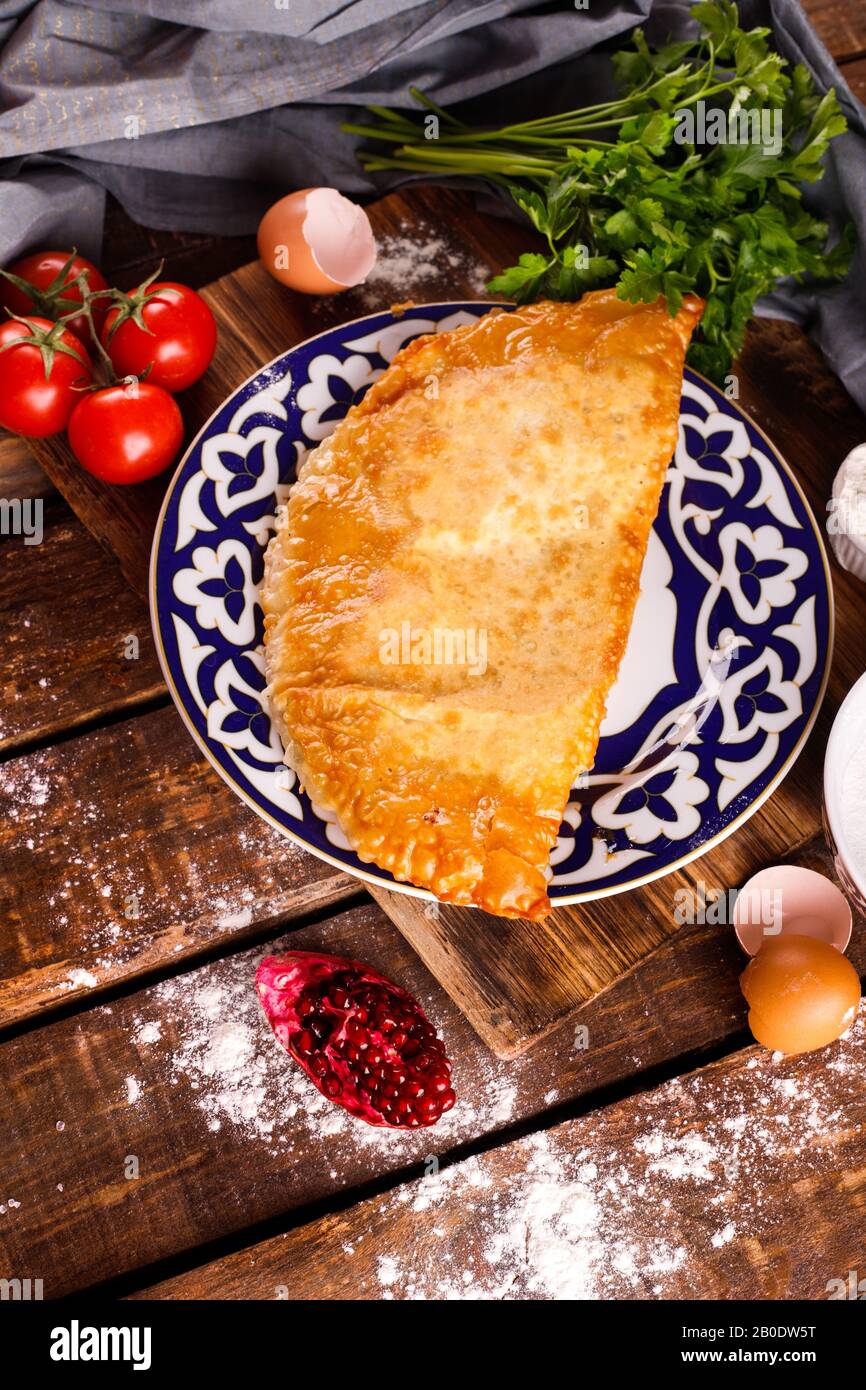 Original portion of meat pie in the restaurant. Belyash with meat ...