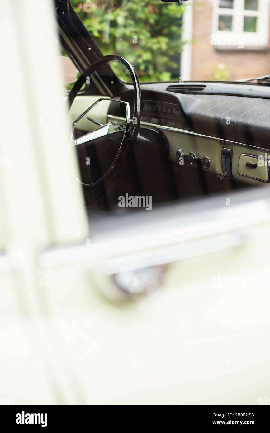 Steering wheel and interior of vintage 60s car Stock Photo - Alamy