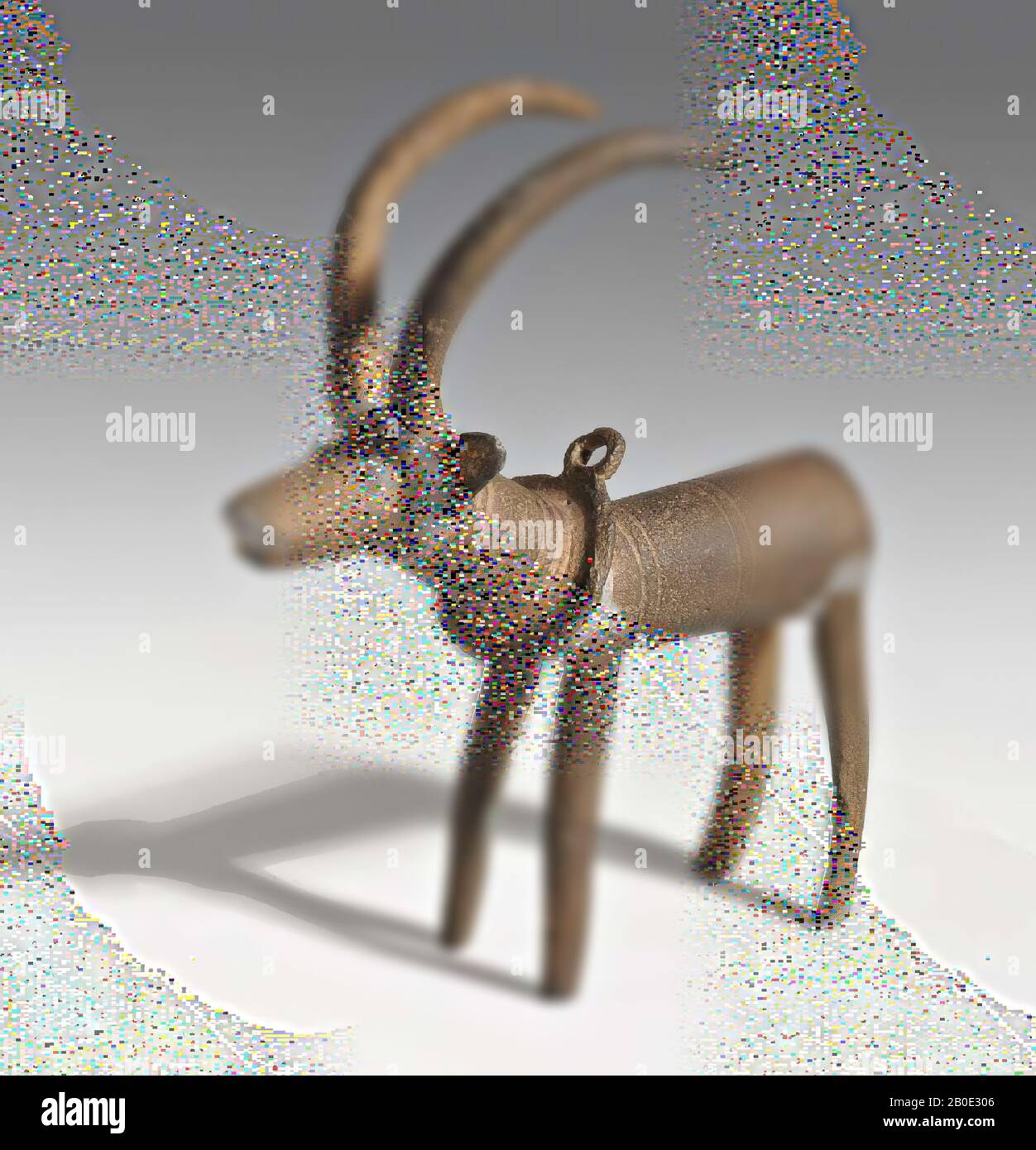 A bronze figure of a ibex, probably from the Caspian area. It has a ...