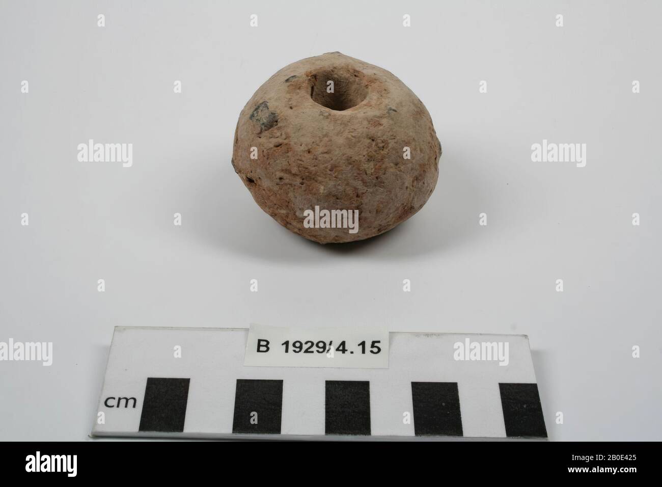 A round weaving weight of clay, drilled, tools, clay, H 4 cm, D 5.5 cm ...
