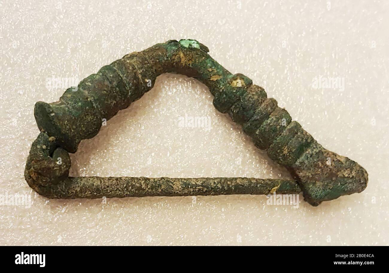 Bronze fibula. The fibula is triangular. For decoration, there are some ...