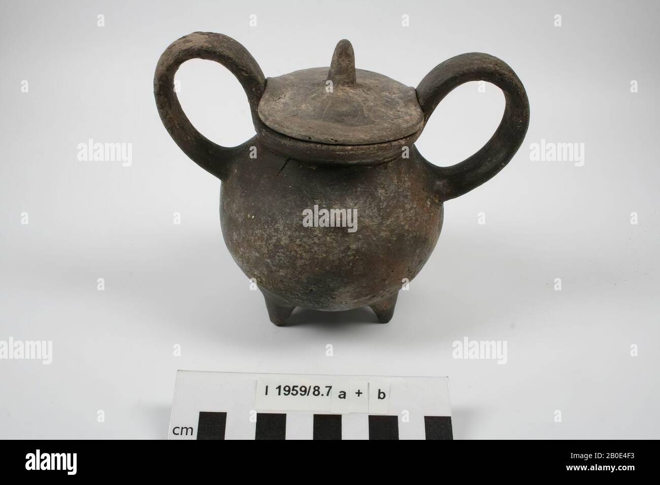 A four-legged globular jug with two bent ears, crockery, pottery, H 13 ...