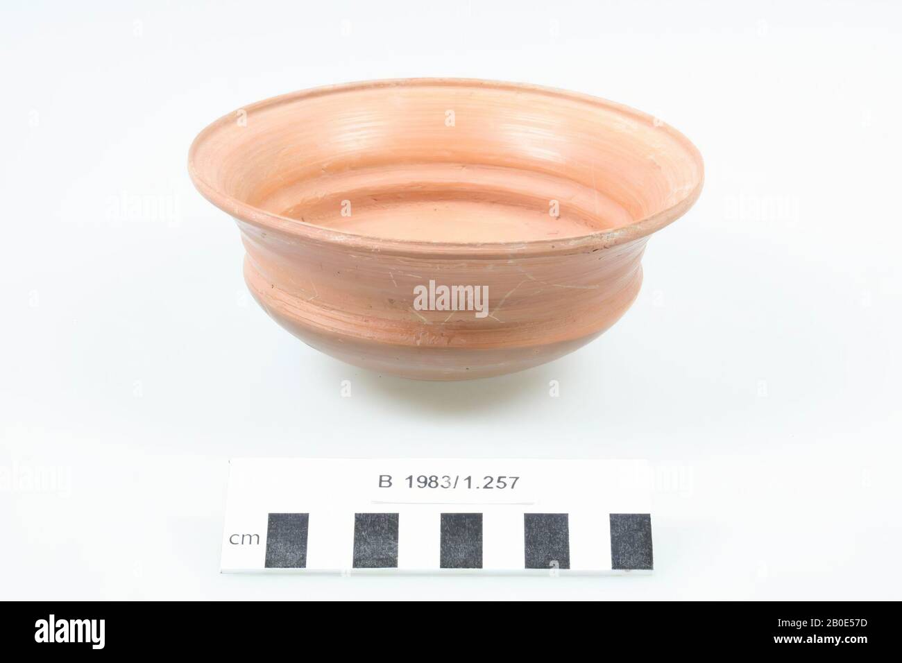 An earthenware bowl with a flared edge and a kink in the profile ...