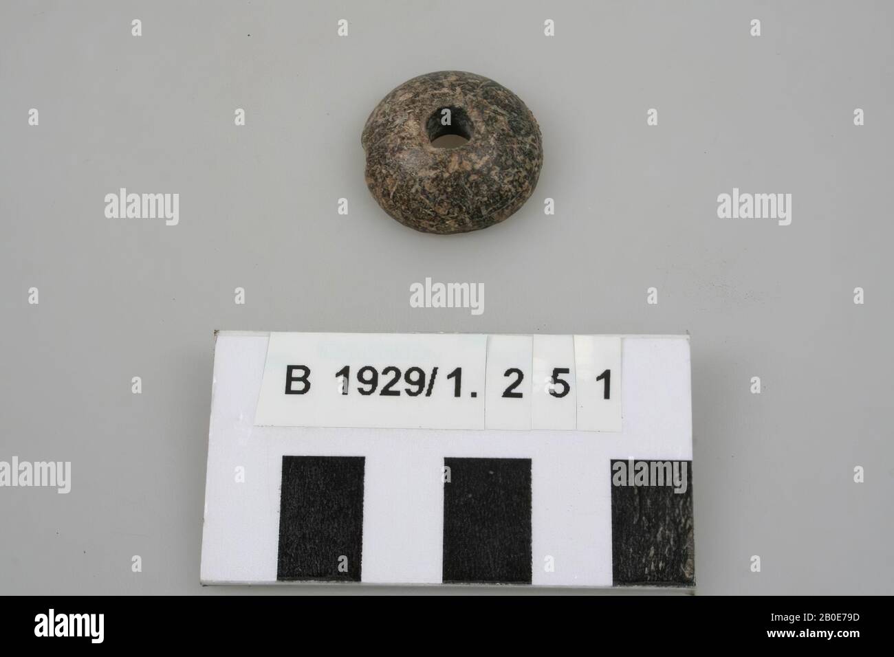 A conically shaped spider with a biconcaver hole, spider stone, D 2,5 ...