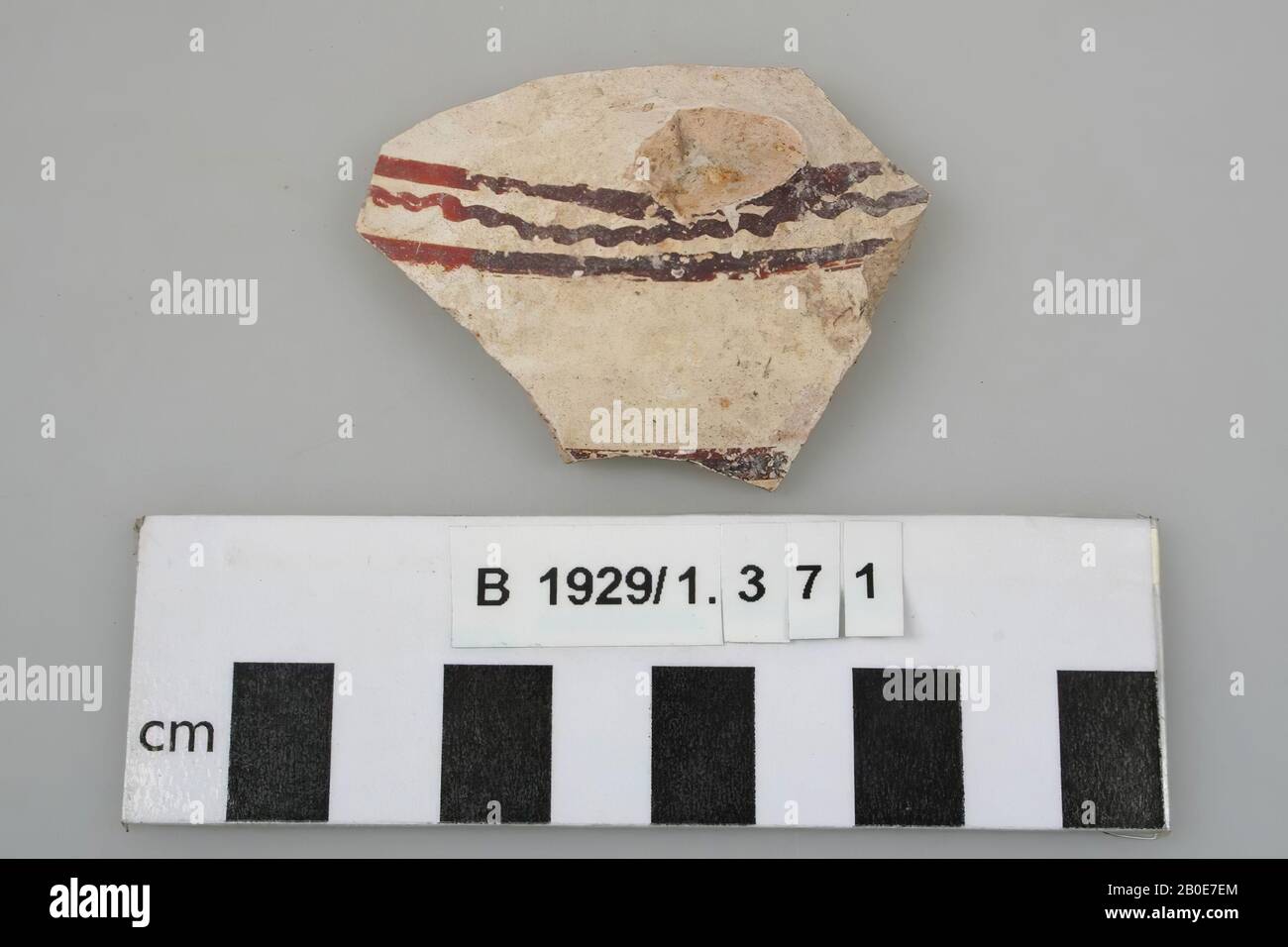 A wall shard with a jar of a jug, slips white and painted with dark red ...