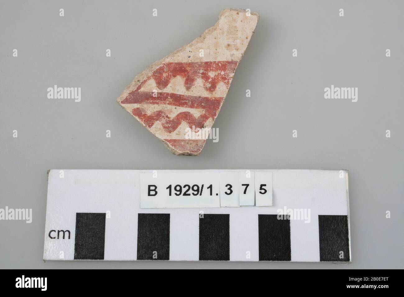 A wall shard, slit white and painted with red paint, shard, earthenware ...