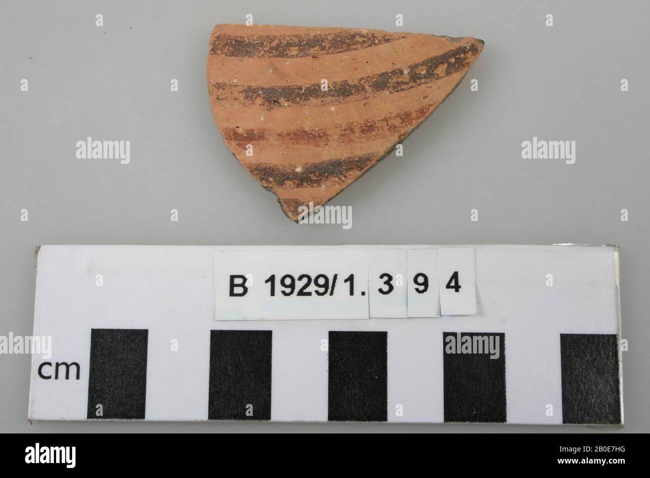A wall shard, painted with red and black paint., Crockery, earthenware ...