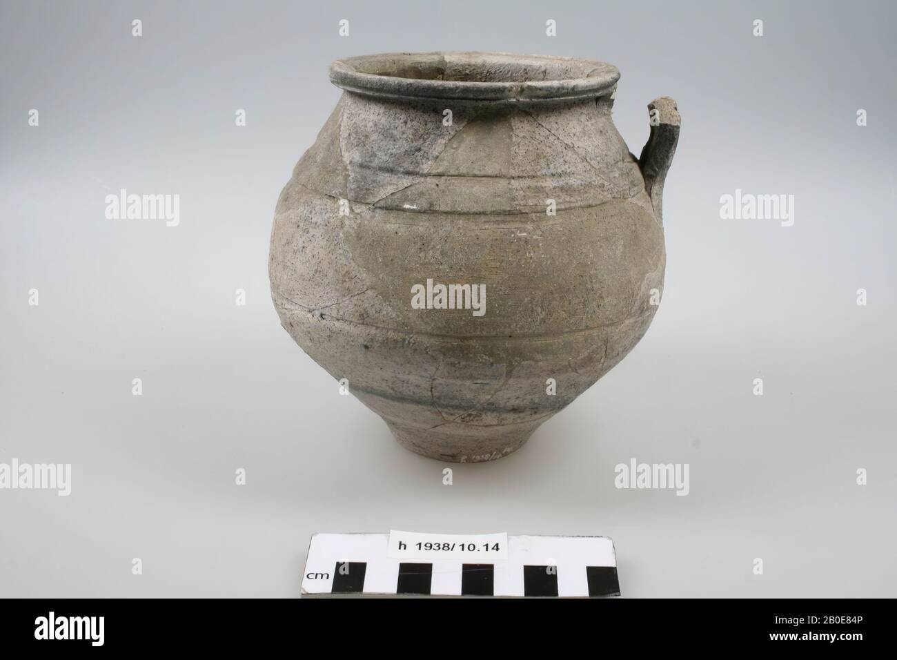 Ear pot of gray rough-walled earthenware. Ear damaged. Many glueing and ...