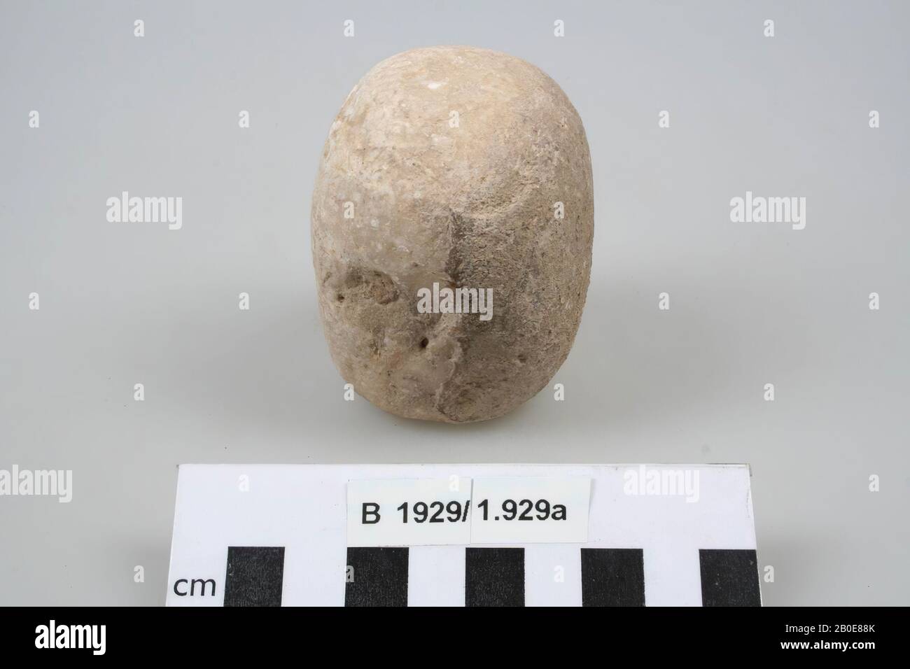 A conical stone used as pestle or rubble stone., Grindstone, stone ...