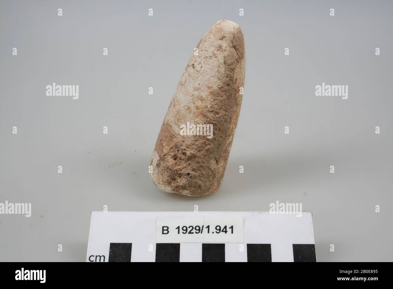 A tall, conical shaped stone, varia, stone, limestone, H 9.8 cm, D 4.1 ...