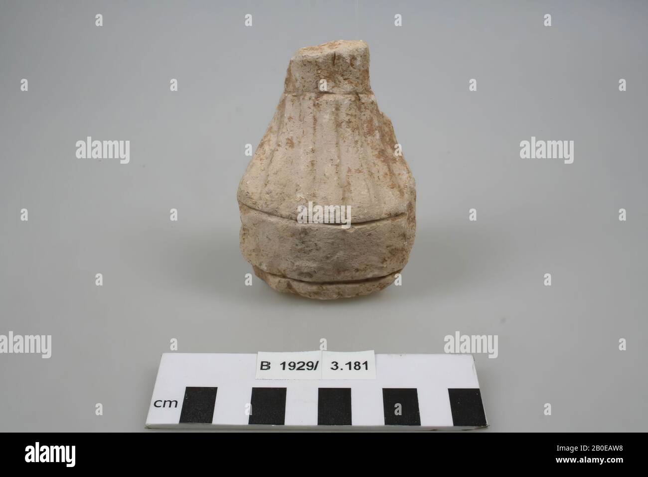 A fragment of a limestone object. It was probably the bottom of an ...