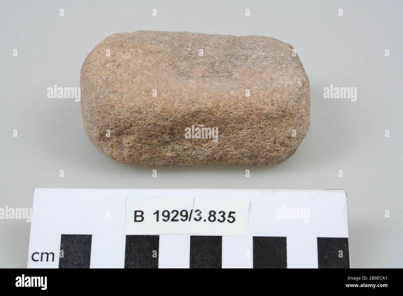 An oblong shaped rubble made of sandstone. The sides are slightly ...