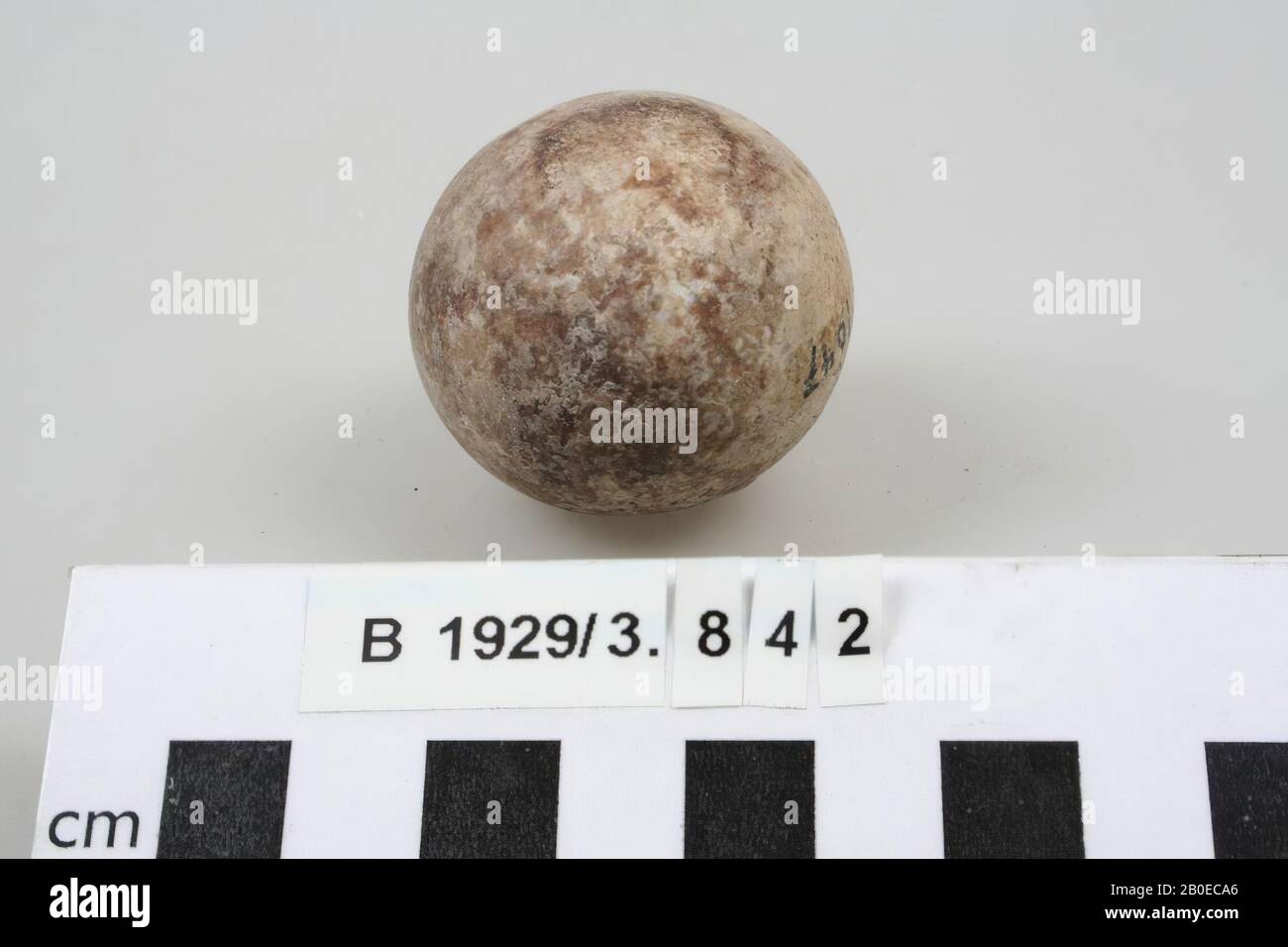 A round stone, used as a pestle or pillar stone, grindstone, weapon ...