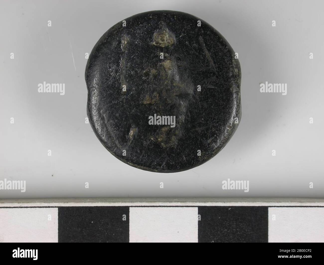 A stamp seal. Pictured is a sitting bird with the head turned 180 ...