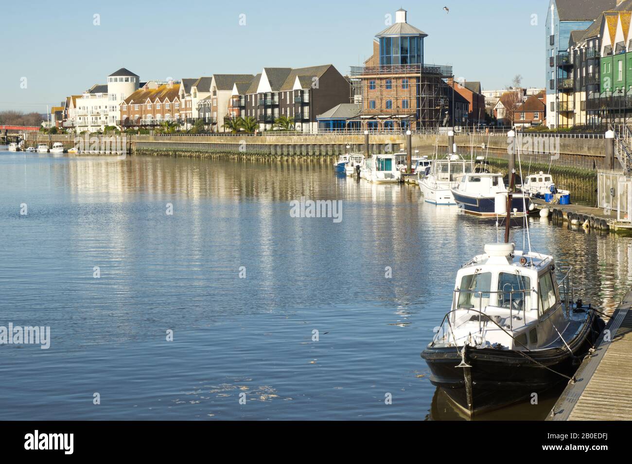 Littlehampton, England - November 28, 2019: Moored boats and apartment ...