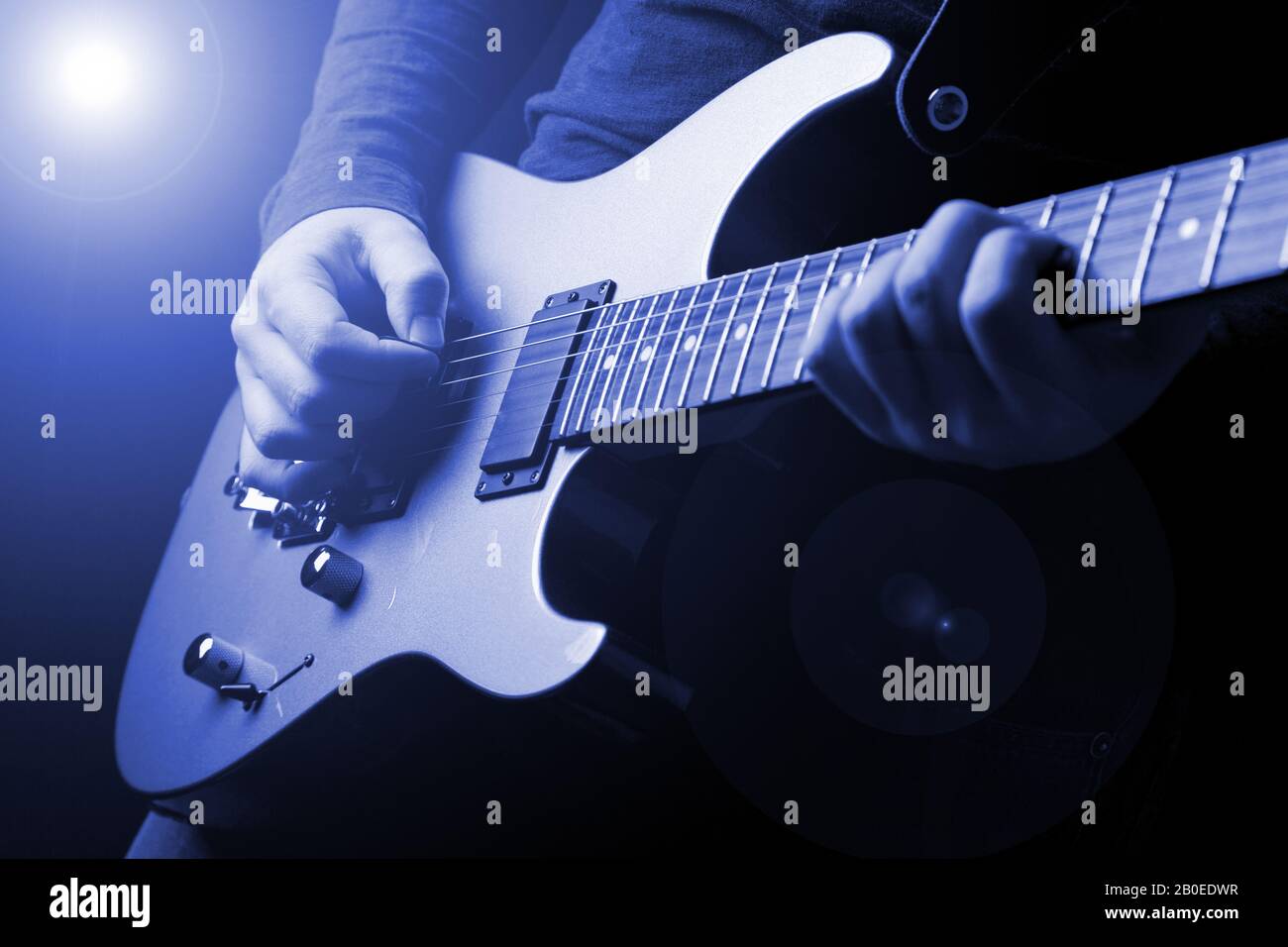 musician rock guitarist playing a guitar Stock Photo - Alamy