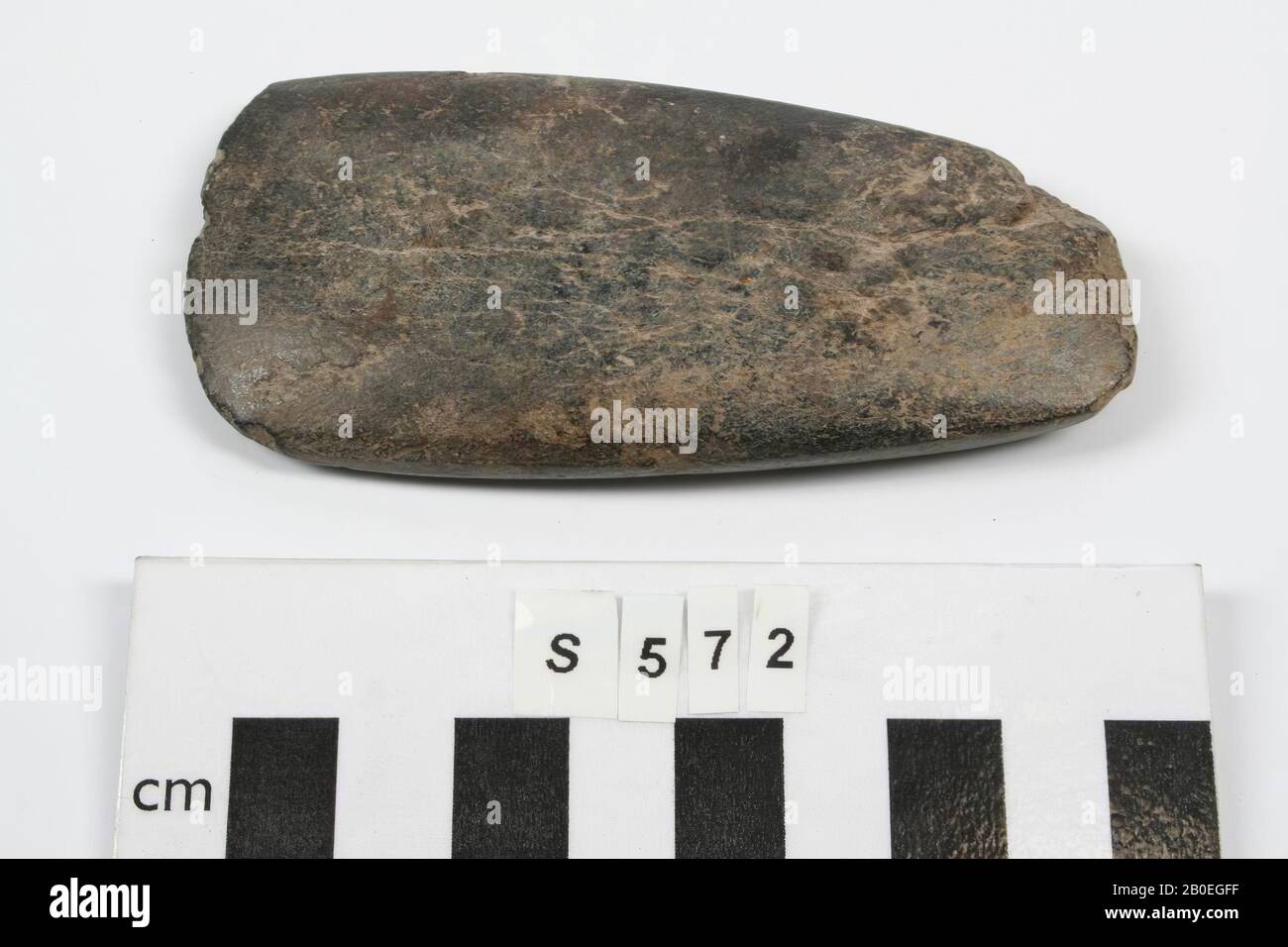 A wedge-shaped stone ax, sharpened, tools, weapon, stone, L 9 cm, W 4 ...