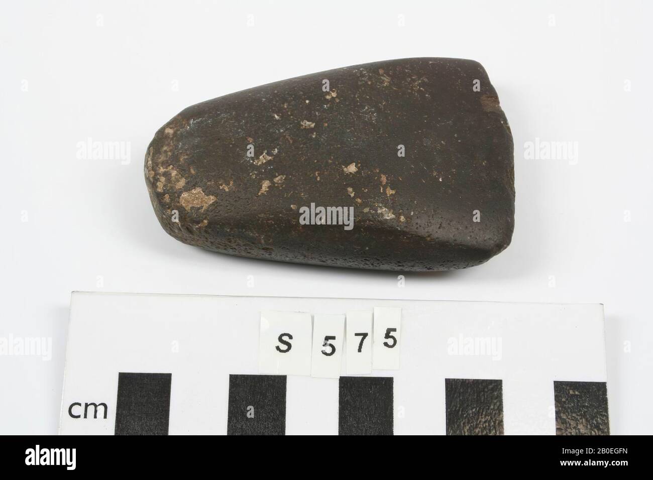 A wedge-shaped stone ax, wider to the edge., Tools, weapon, stone, L 7. ...